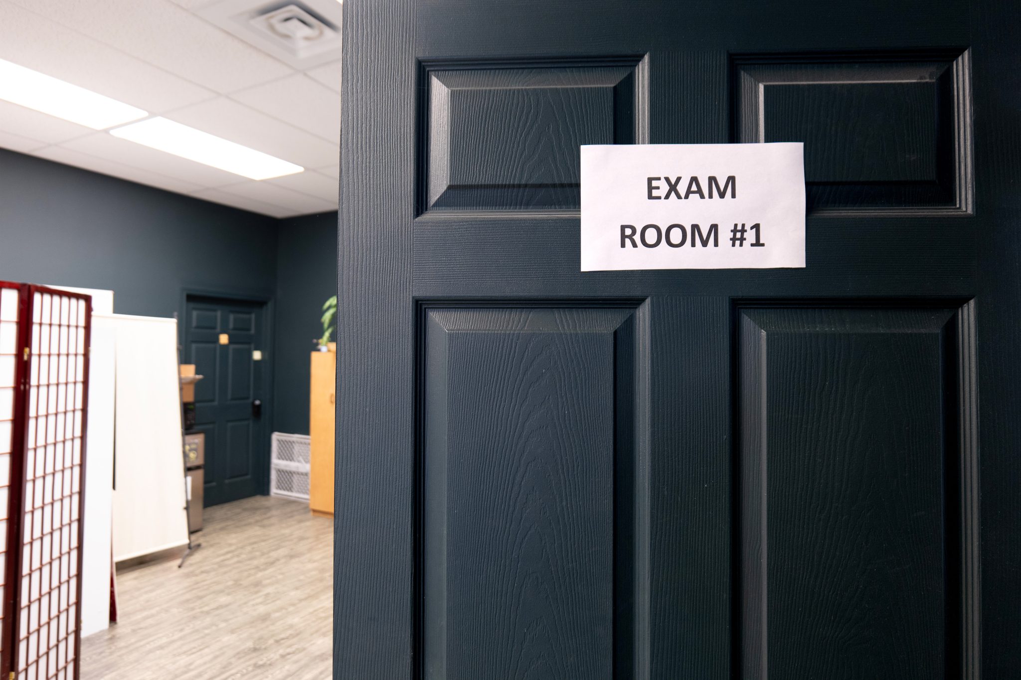 BMH2H027 Exam room door in community health care clinic – Empathy Lens