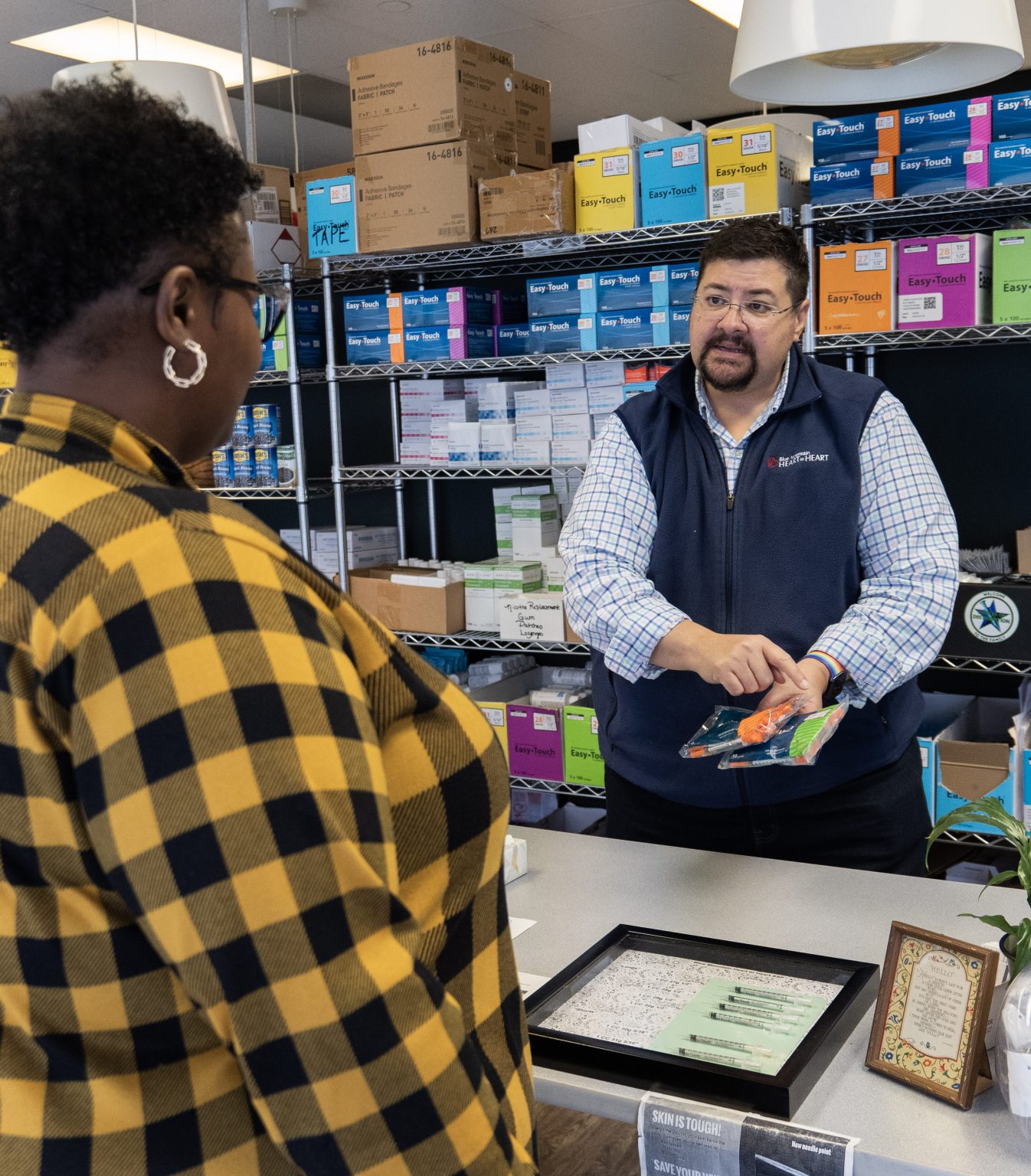 BMH2H064 Syringe services program staff person talking to client about ...